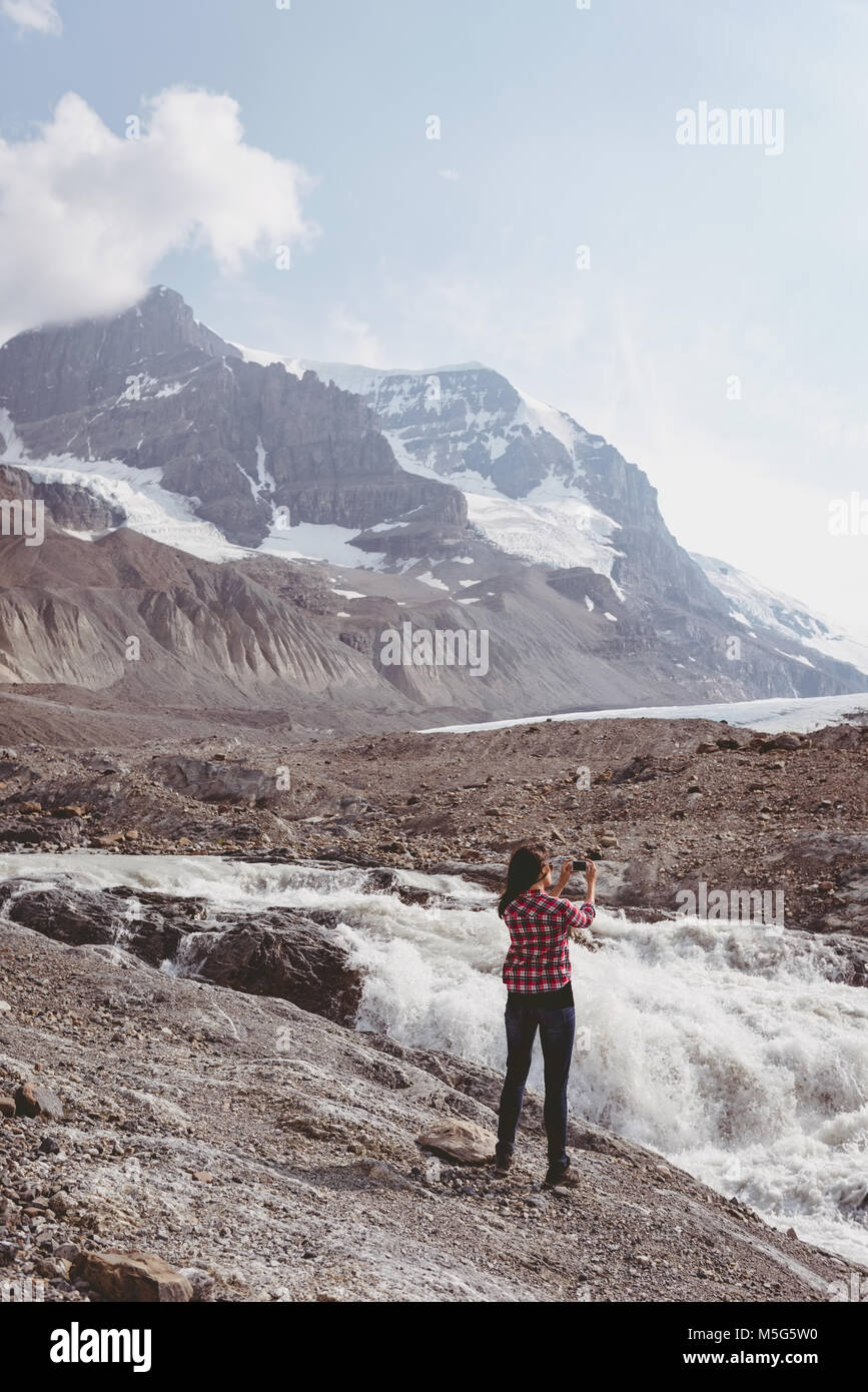 Woman taking photo with mobile phone Stock Photo - Alamy