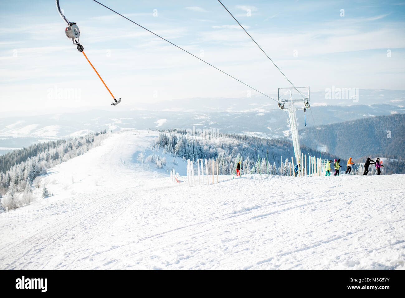 Snowy mountains with ski slopes Stock Photo - Alamy