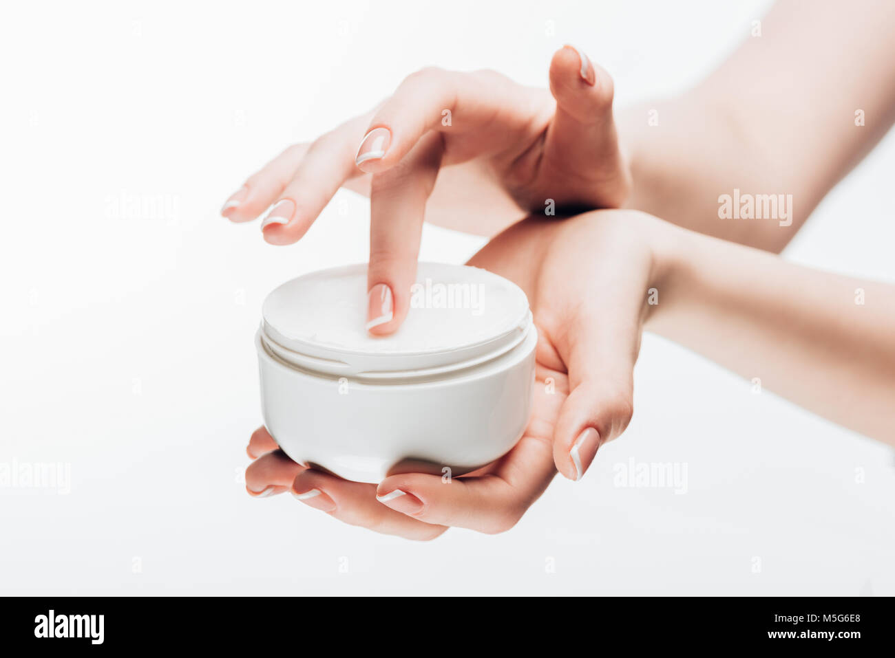 Woman applying moisturizing cream on hands hi-res stock photography and ...