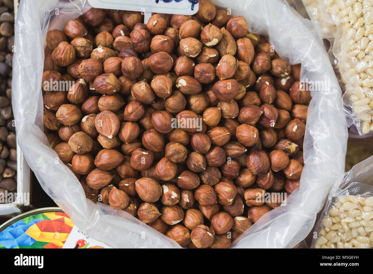 Heap of peeled hazelnuts at street market Stock Photo - Alamy