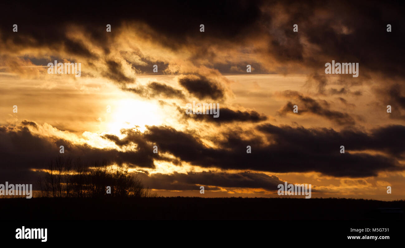 Dark orange sunset sky at winter Stock Photo - Alamy