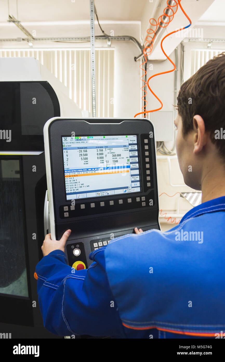 Man worker manage remote control for robotics arm technowelding on ...