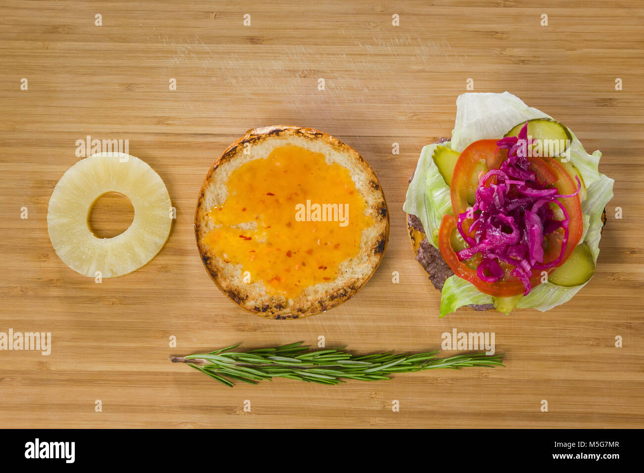 Open burger with pineapple, onion and vegetables Stock Photo - Alamy