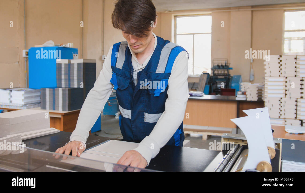 Press operator over a clean sheet of paper Stock Photo - Alamy