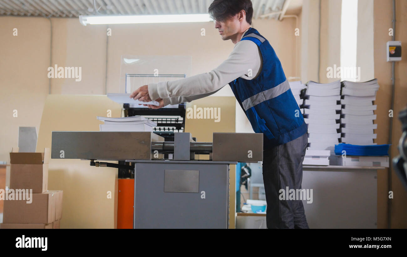 Feeding paper sheets hi-res stock photography and images - Alamy