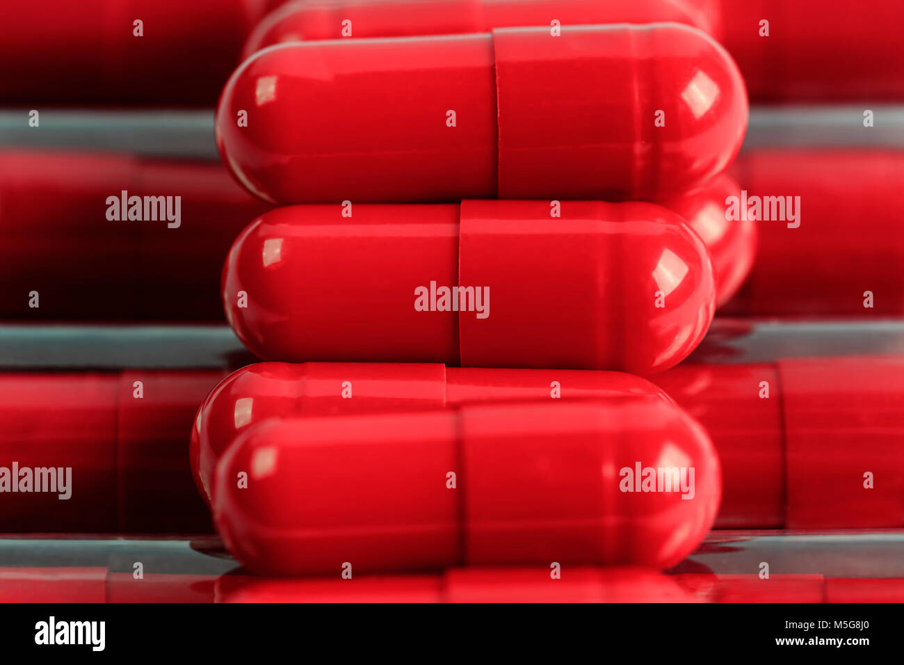 Set of red pills Stock Photo - Alamy