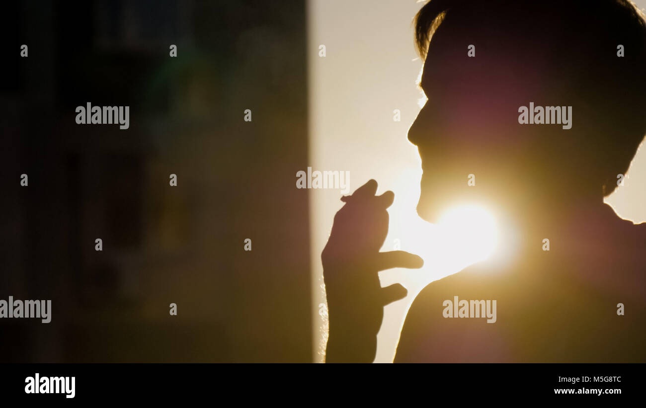 Portrait of a lonely man smoking cigarette Stock Photo - Alamy