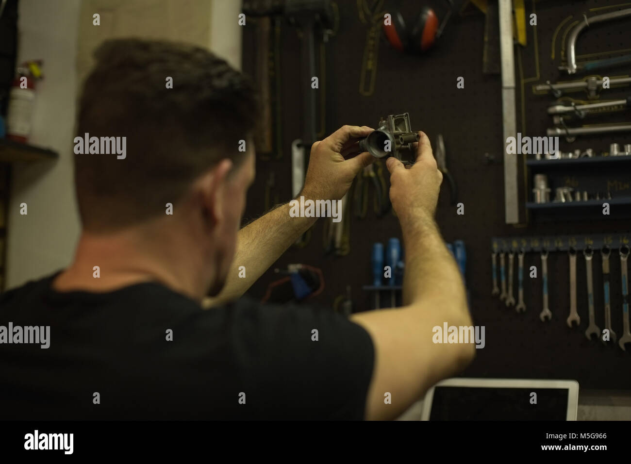 Automobile mechanic repairman checking hi-res stock photography and ...