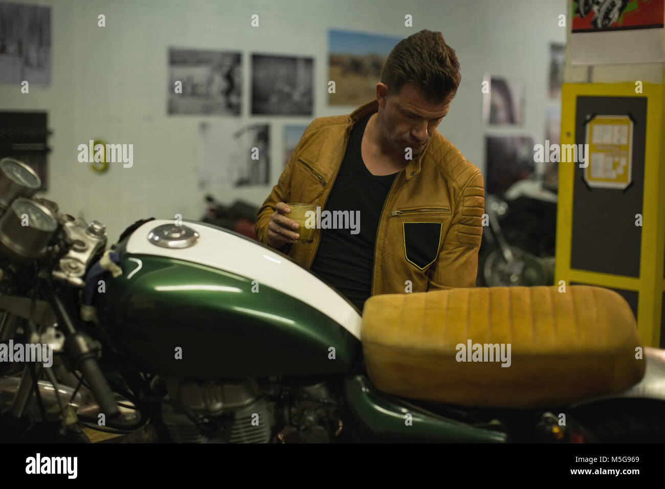 Mechanic working motorcycle workshop High Resolution Stock Photography ...