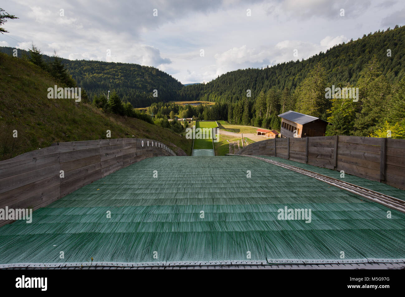 Top view of Ski jumping slope and tracks on summer Stock Photo - Alamy