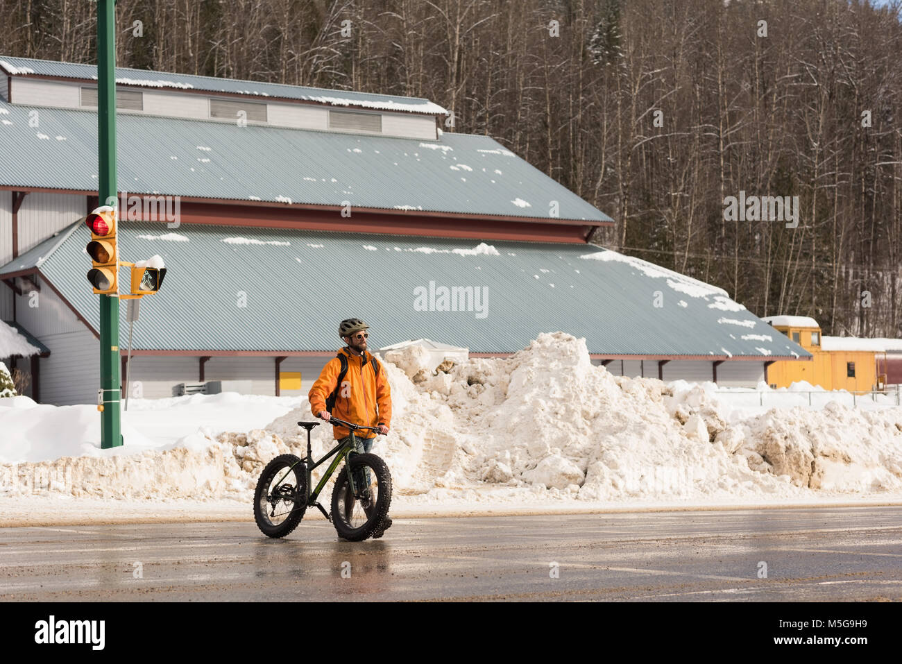 Man walking with cycle hi-res stock photography and images - Alamy