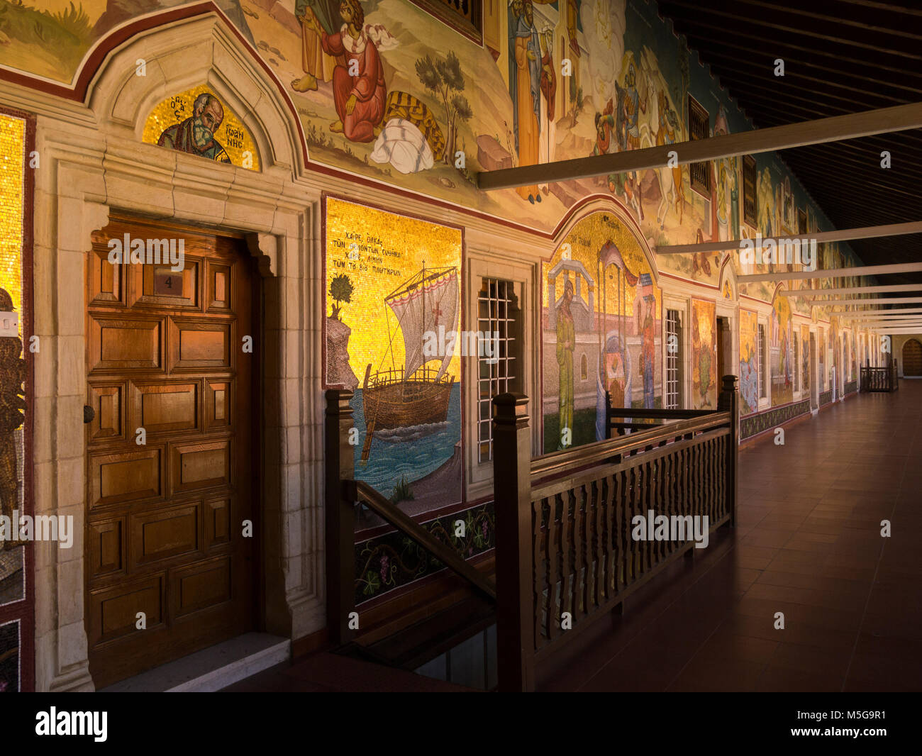 Colourful religious mosaics along wooden walkway at Kykkos Monastery ...