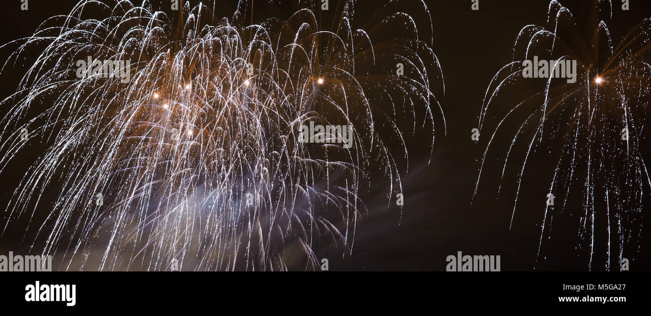 Beautiful fireworks on night sky Stock Photo - Alamy