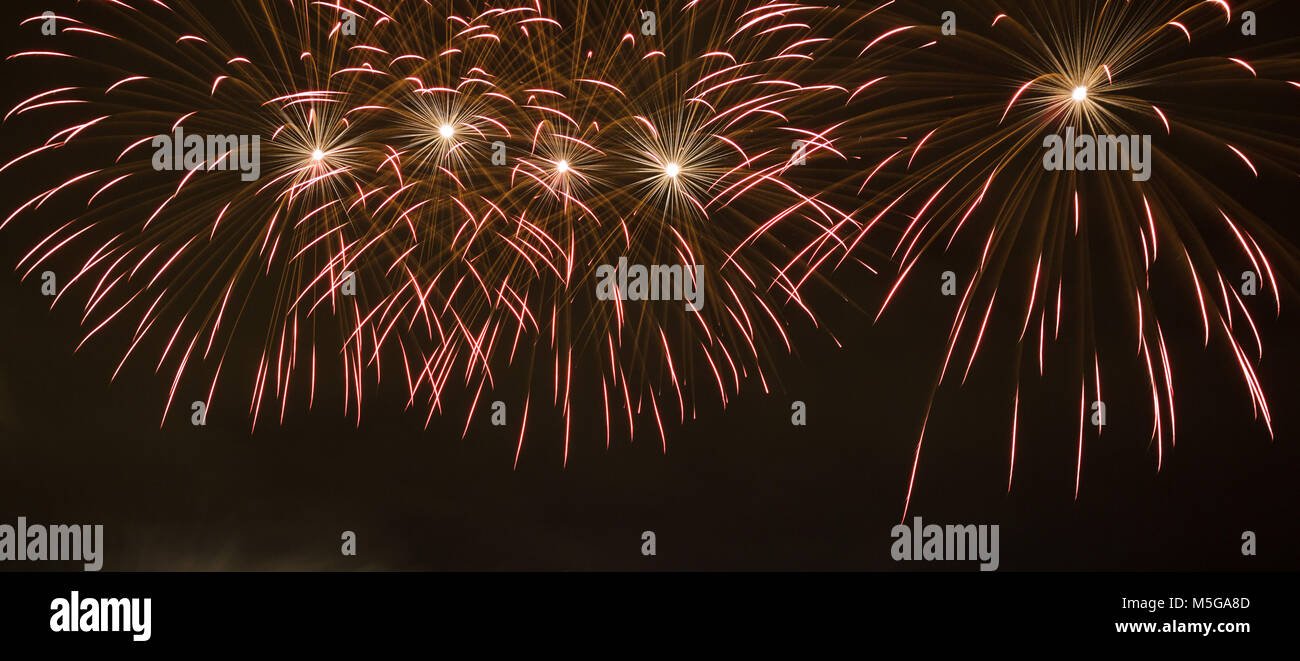 Beautiful fireworks on night sky Stock Photo - Alamy