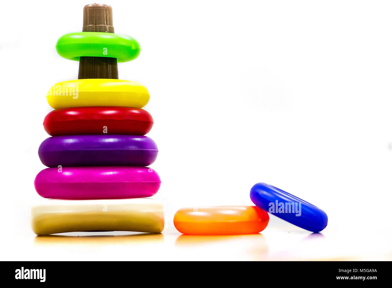 Colourful plastic ring stacking toy for children Stock Photo - Alamy
