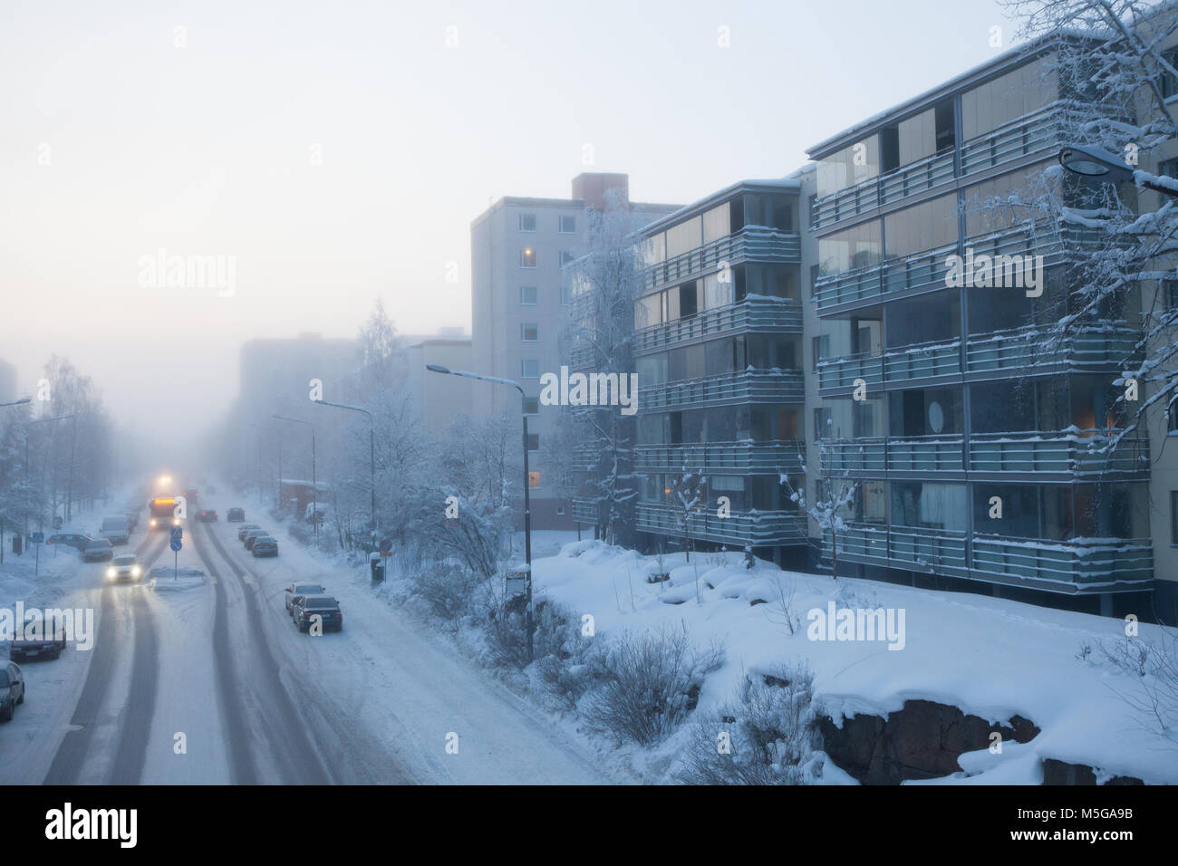 Small city street at cold foggy day Stock Photo - Alamy