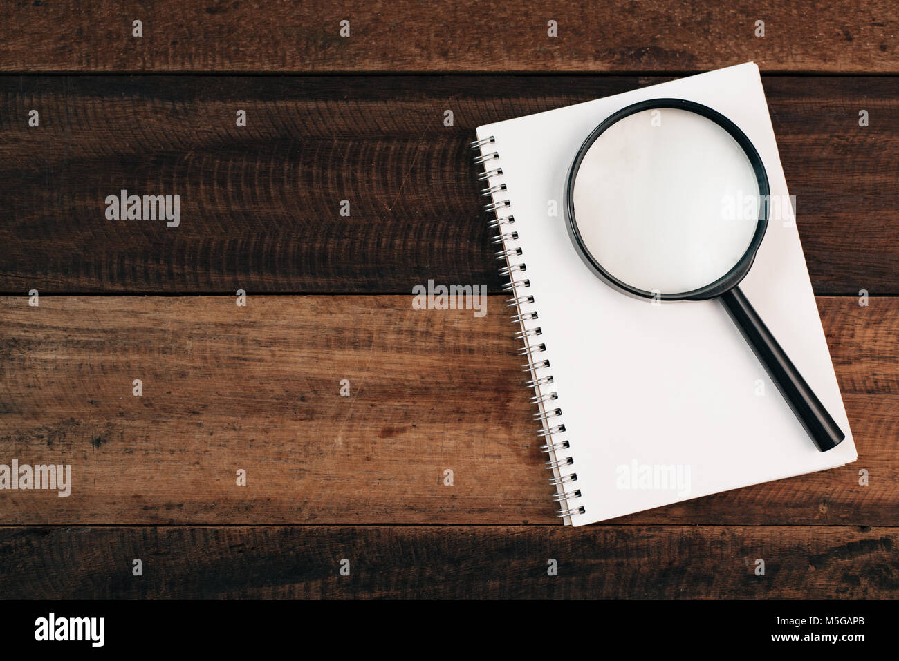Book magnifying glass concept education hi-res stock photography and ...