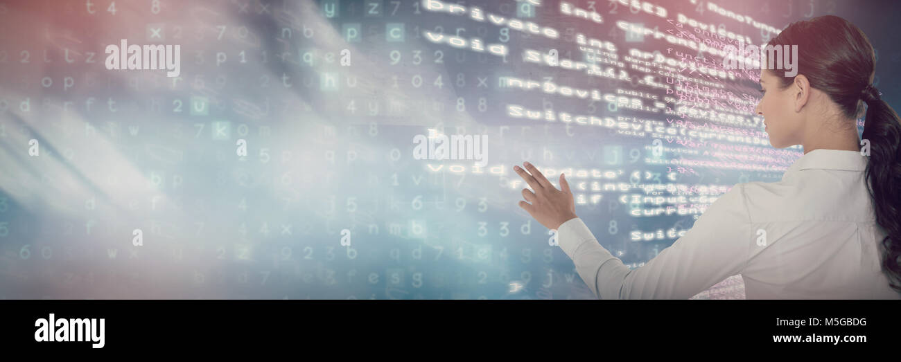 Composite image of female executive pressing an invisible virtual ...