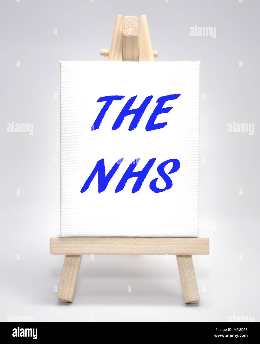 The NHS concept white canvas artist easel Stock Photo - Alamy