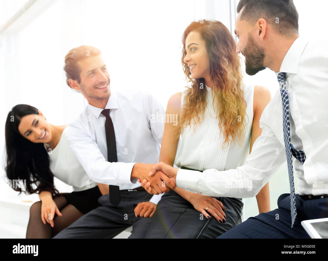 welcome handshake between two colleagues Stock Photo - Alamy
