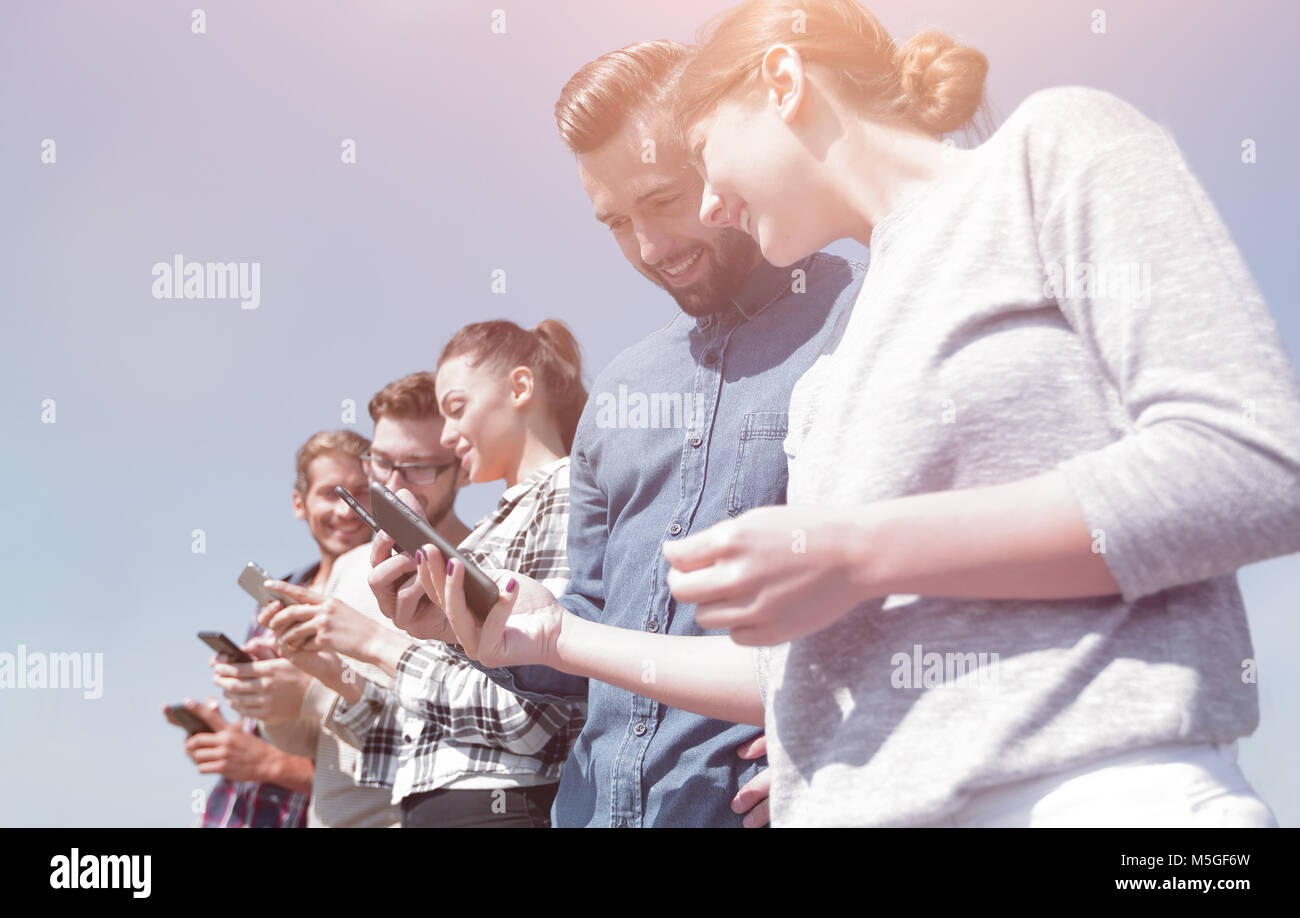 young people using smartphones to search network Stock Photo - Alamy