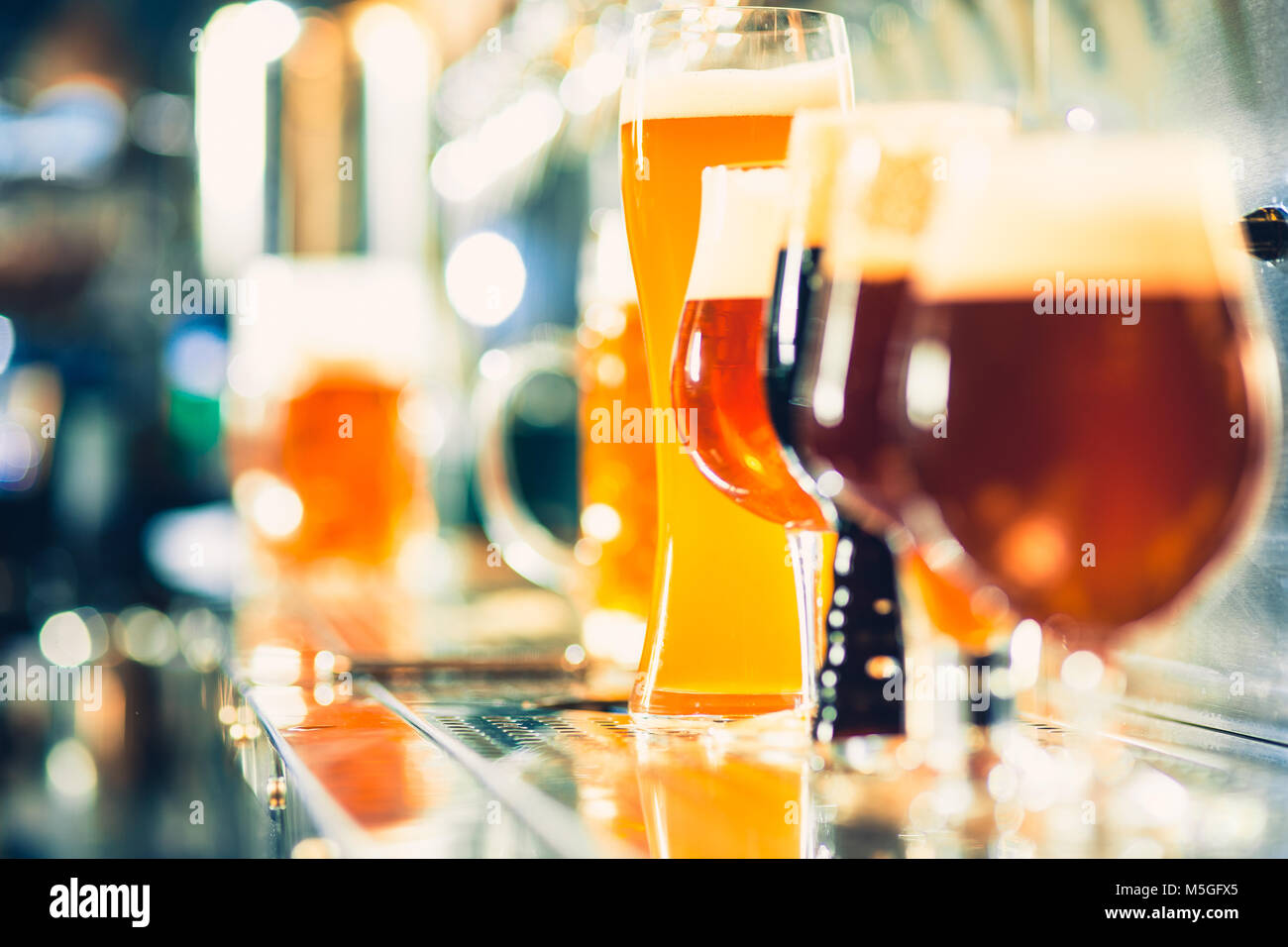 Beer craft. Bar table. Steel taps. Shiny taps. Glassses with beer Stock ...