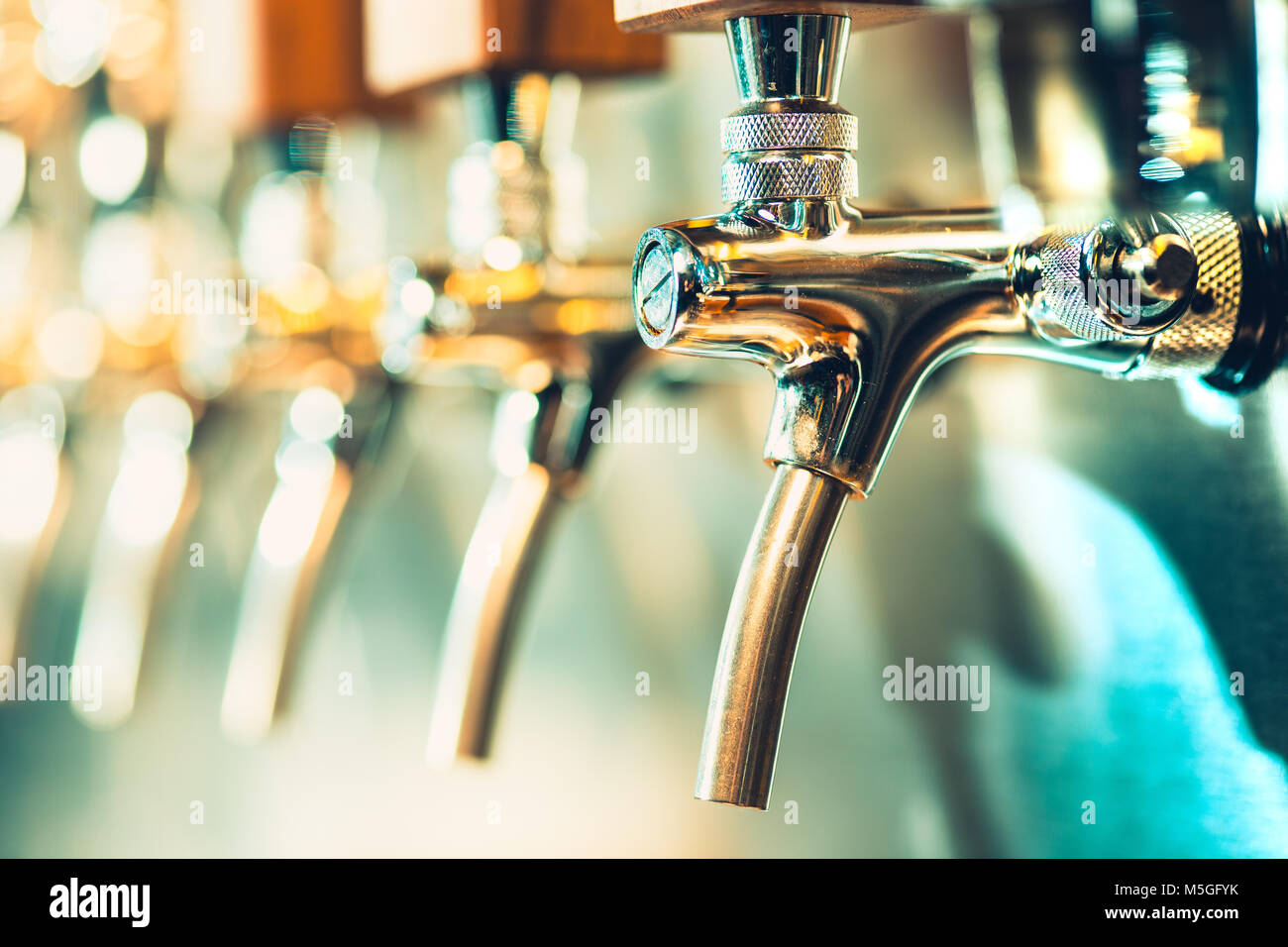 Beer craft. Bar table. Steel taps. Shiny taps Stock Photo - Alamy