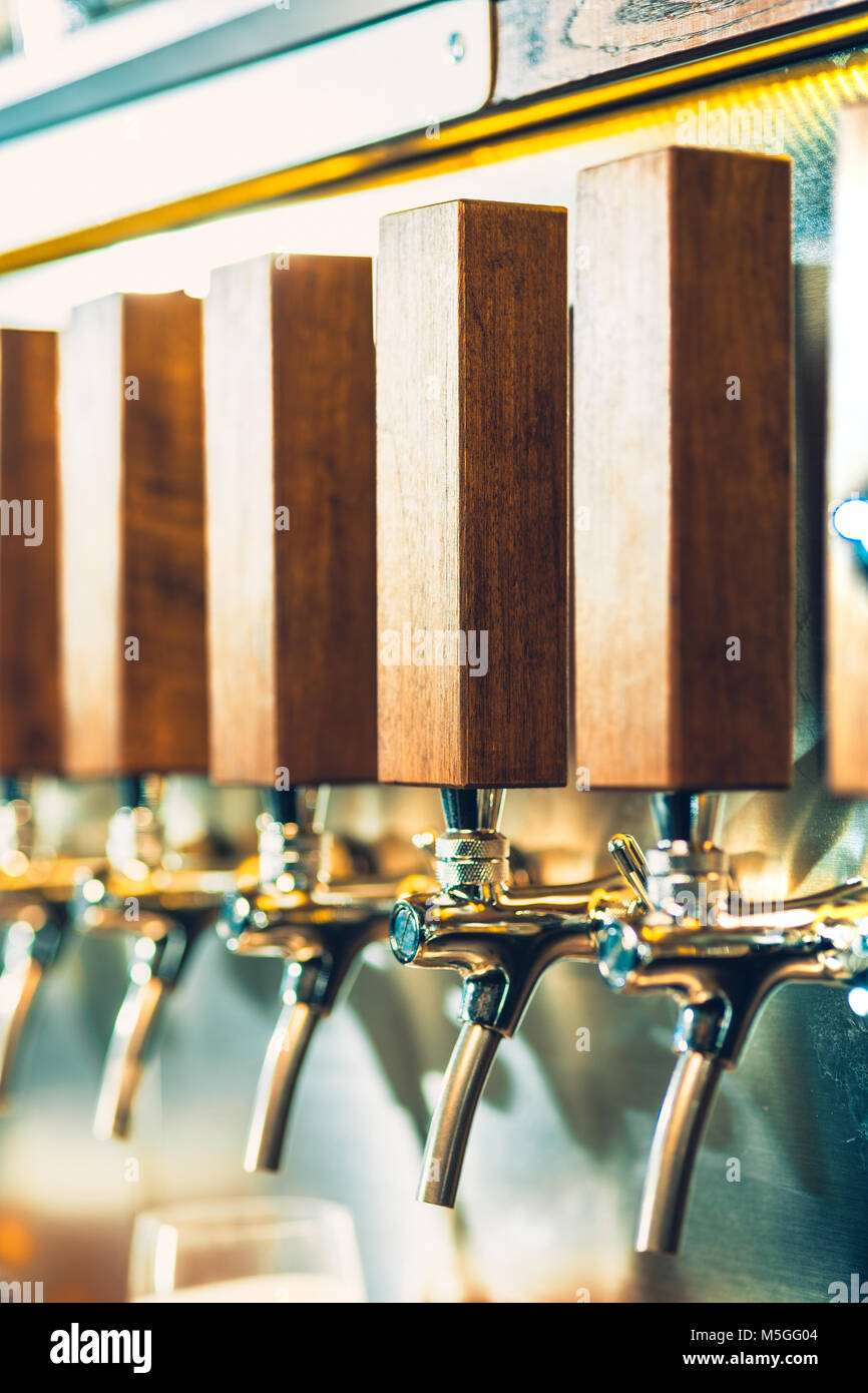 Beer craft. Bar table. Steel taps. Shiny taps. Glassses with beer Stock ...