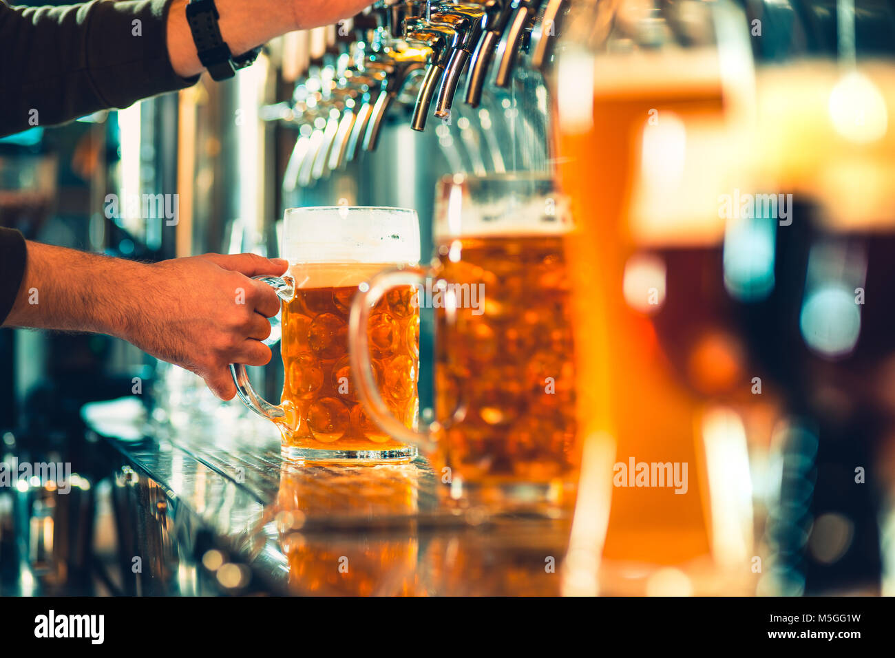 Beer craft. Bar table. Steel taps. Shiny taps. Glassses with beer Stock ...
