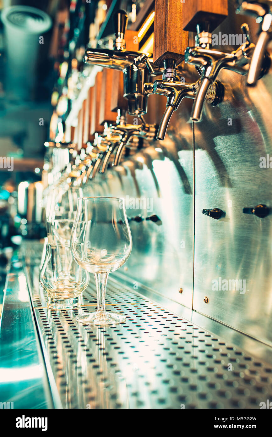 Beer craft. Bar table. Steel taps. Shiny taps. Glassses with beer Stock ...