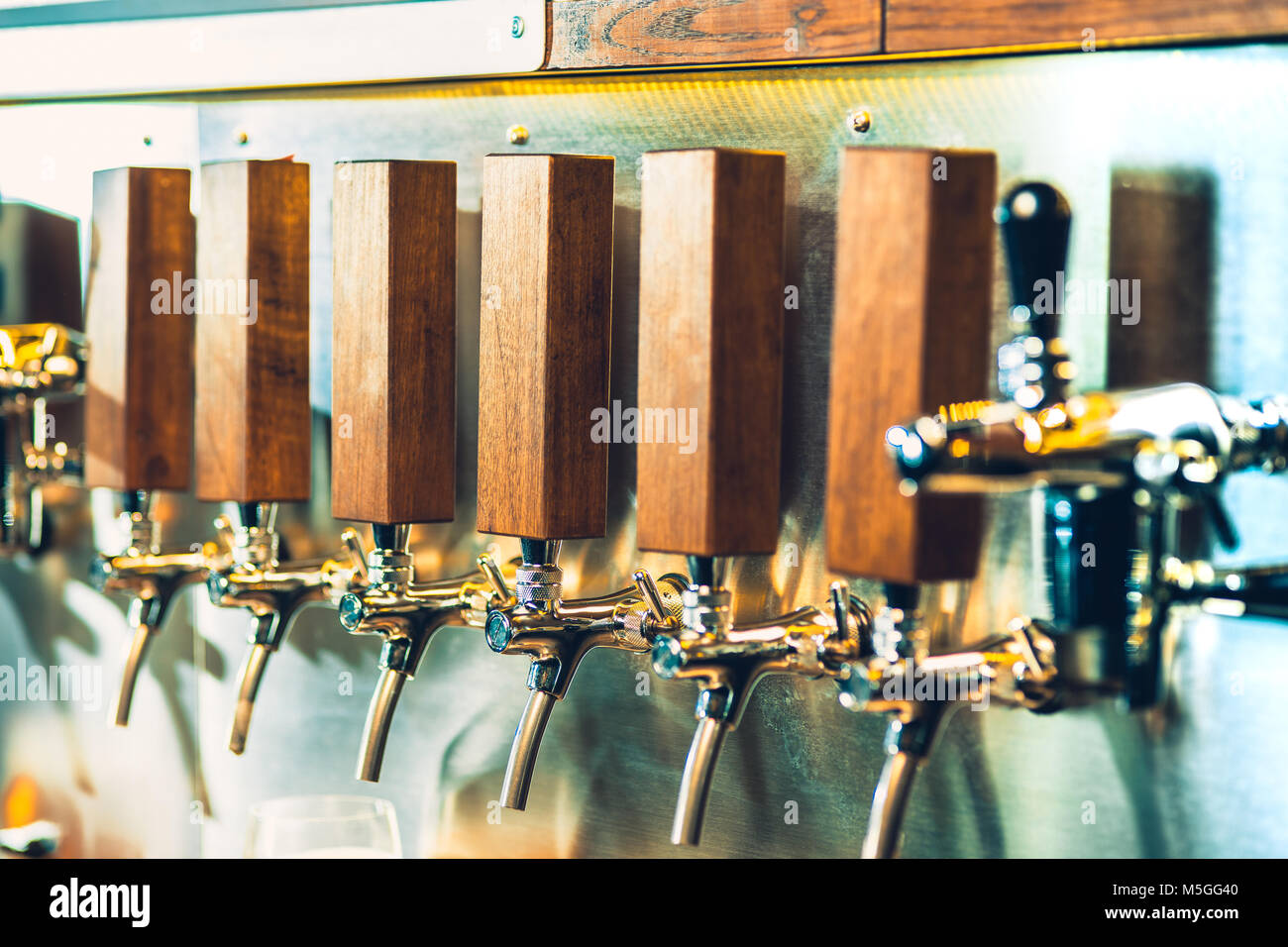 Beer taps in a pub Stock Photo - Alamy