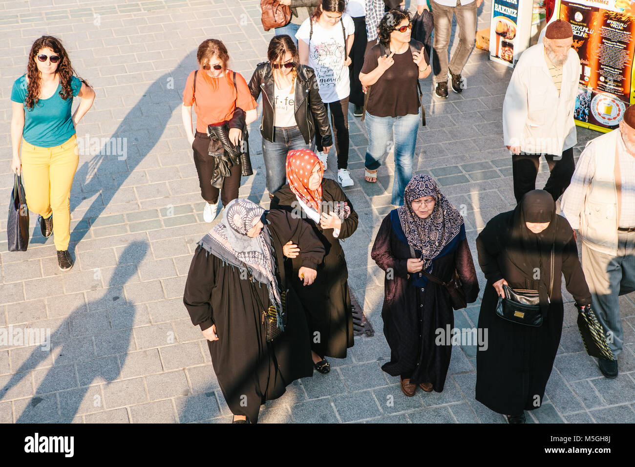 Istanbul, June 15, 2017: A group of women in traditional clothes go and ...