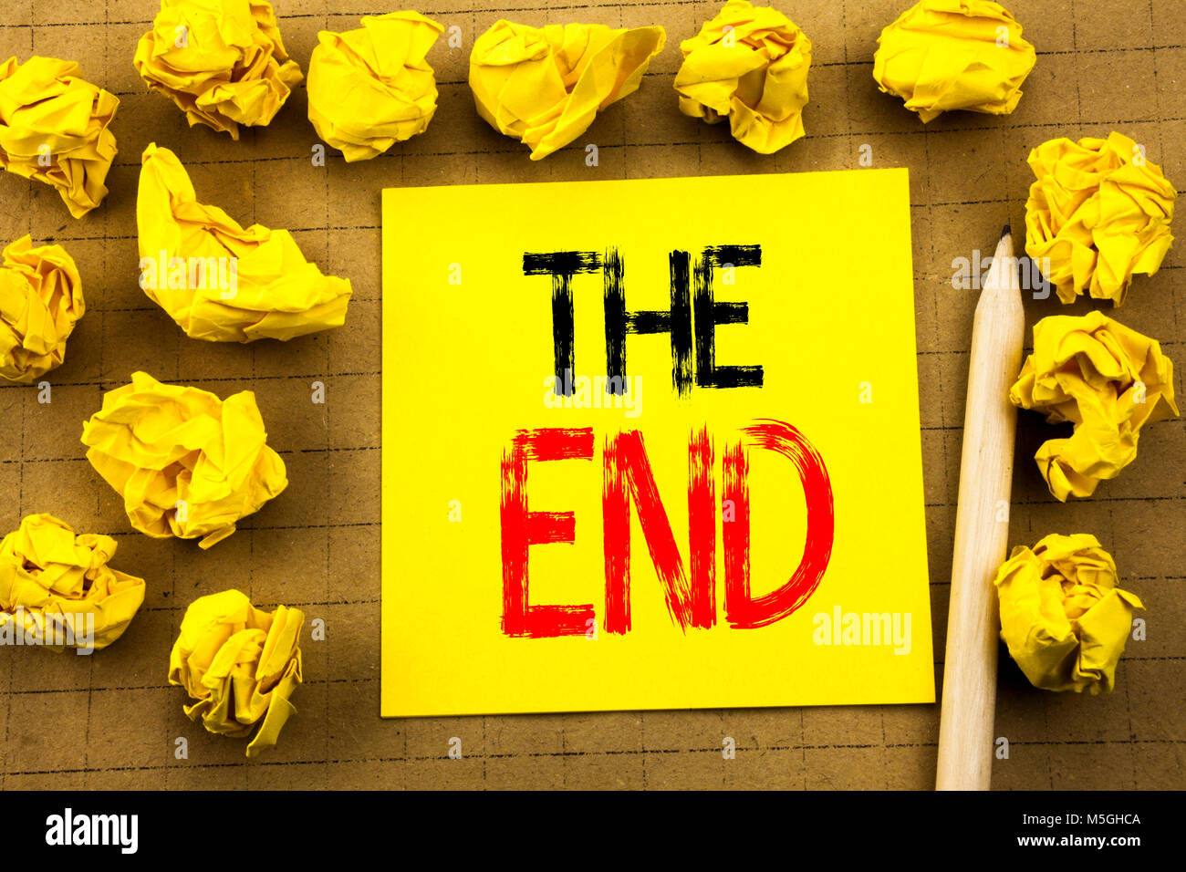 The End. Business concept for End Finish Close written on sticky note ...