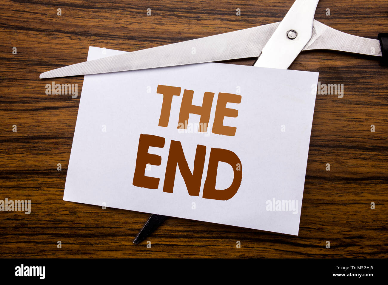 Hand writing text caption inspiration showing The End. Business concept ...