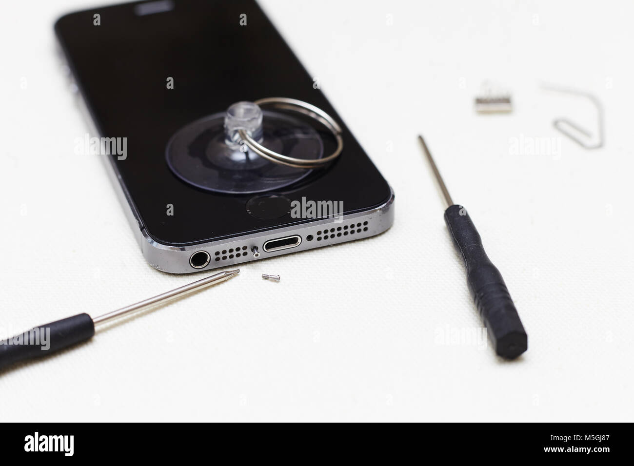 Close-up photos showing process of mobile phone repair, changing the ...
