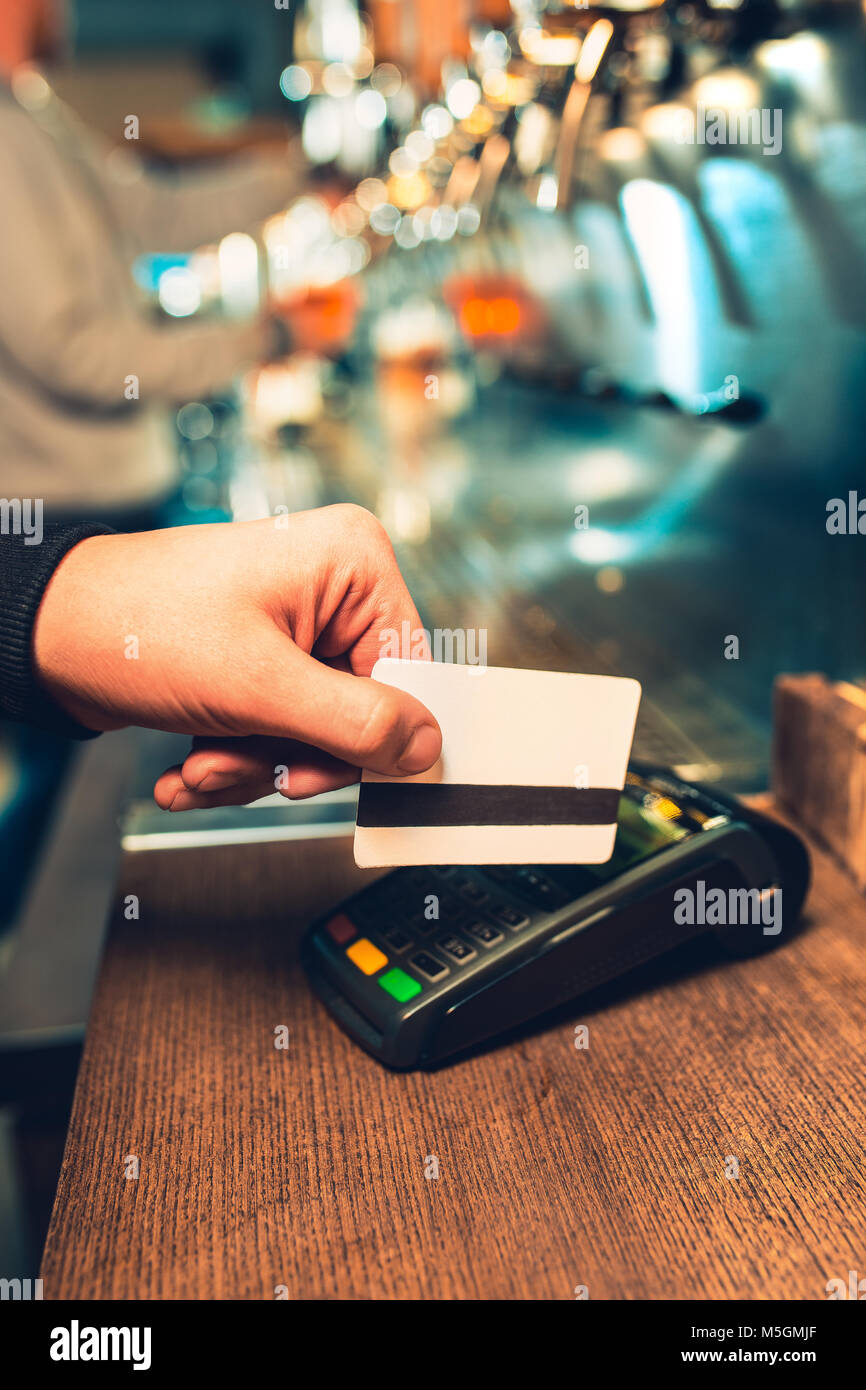 Man using payment terminal Stock Photo - Alamy