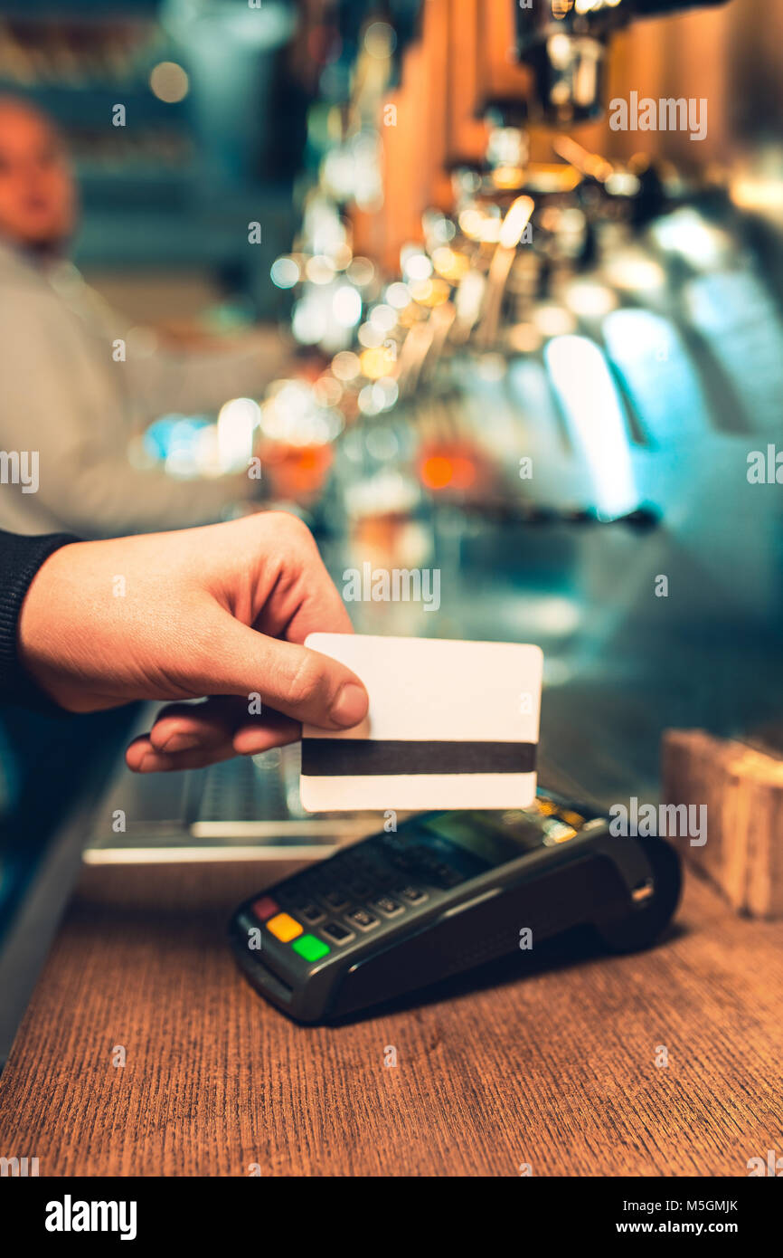 Man using payment terminal Stock Photo - Alamy