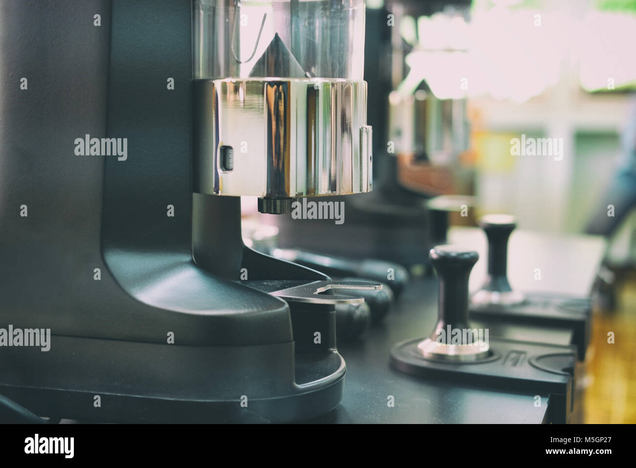 electric coffee grinder machine on bar counter at cafe Stock Photo - Alamy