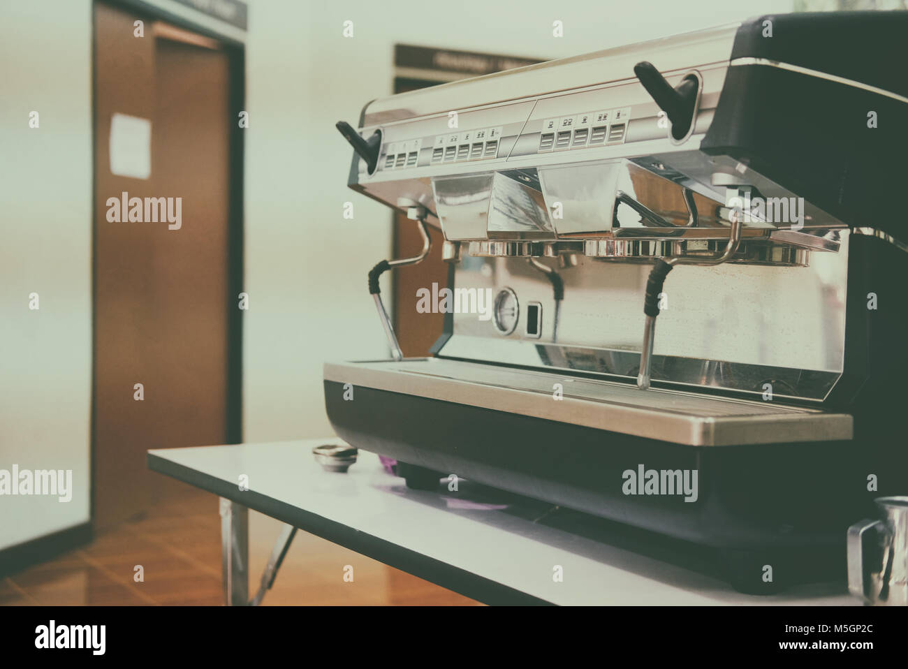 professional coffee machine for brewing espresso on bar counter in cafe ...