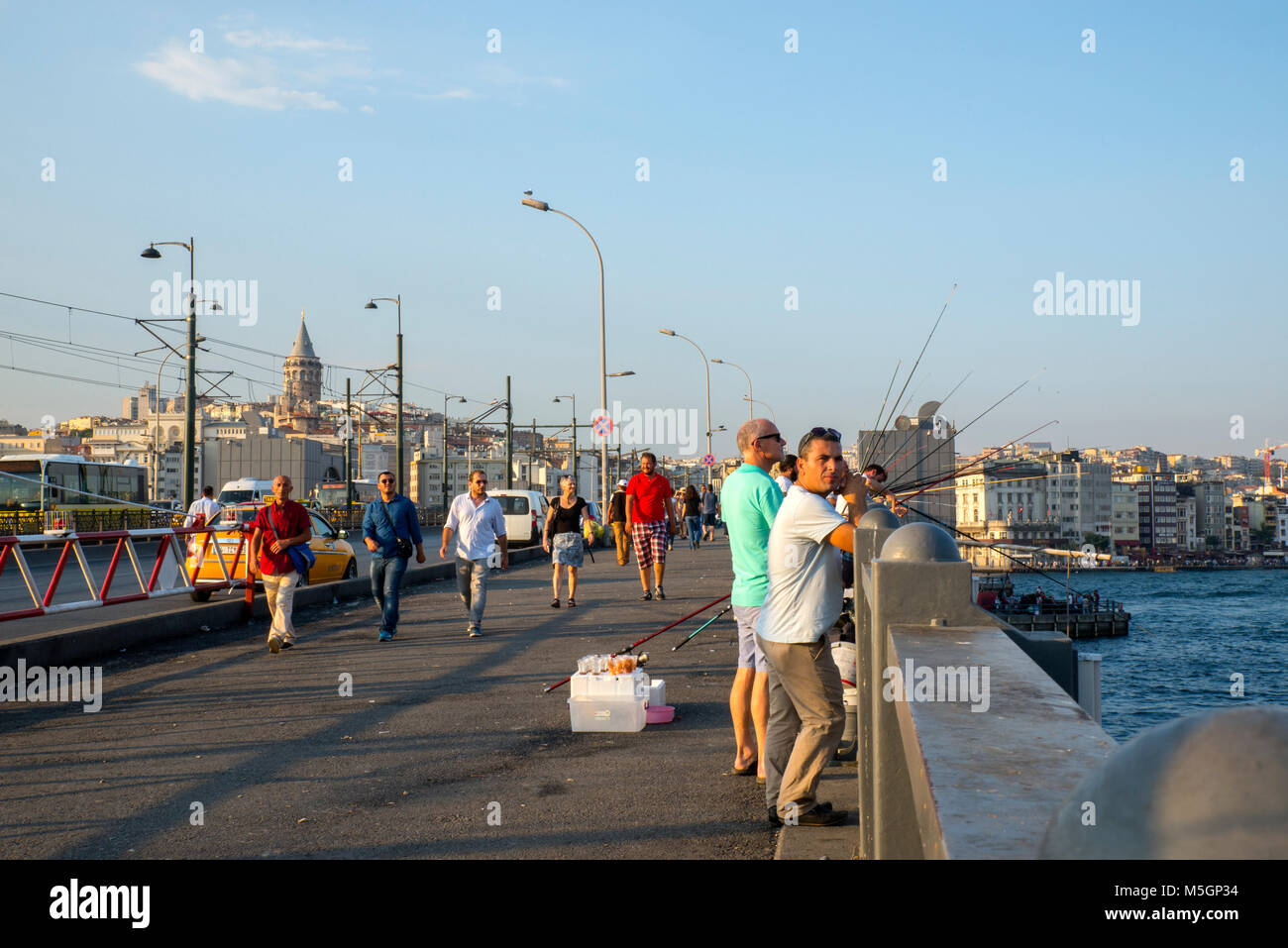 Men fishing on Galata bridge, Istanbul, Turkey Stock Photo - Alamy