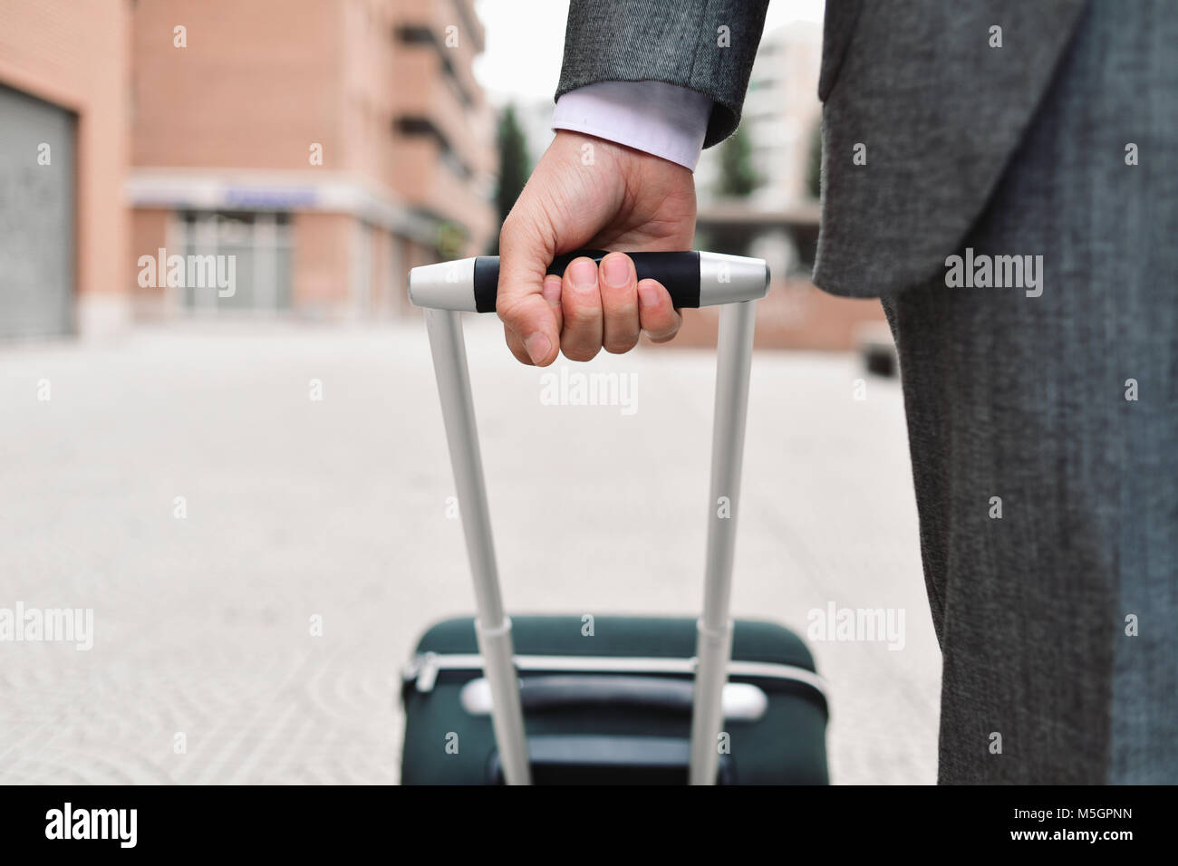 Man pulling trolley hi-res stock photography and images - Alamy