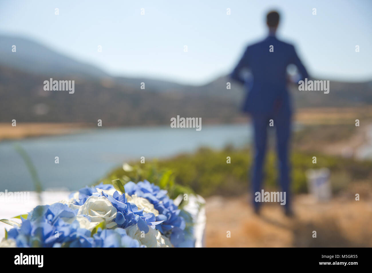 Art fashion photo of groom waiting for the bride Stock Photo - Alamy
