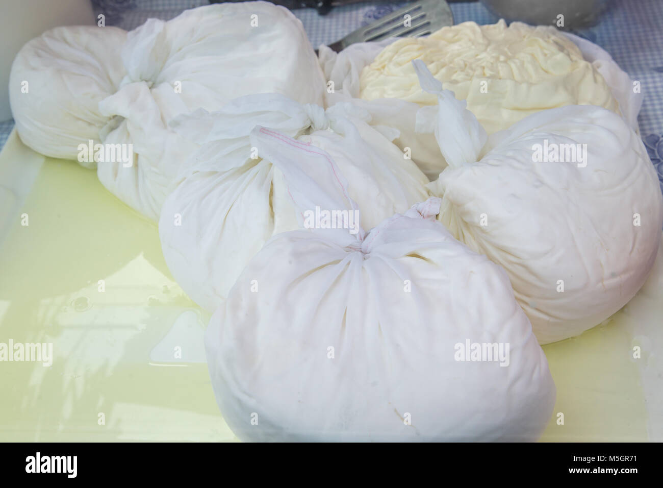 Traditional cheese making with cheescloth Stock Photo - Alamy