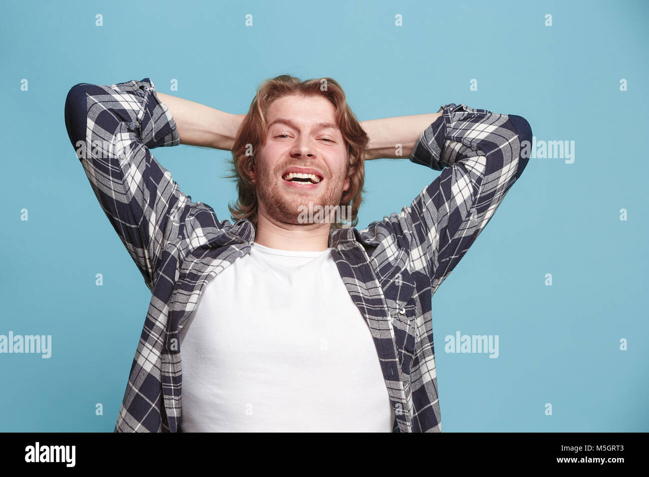 Happy business man standing, smiling isolated on trendy blue studio ...