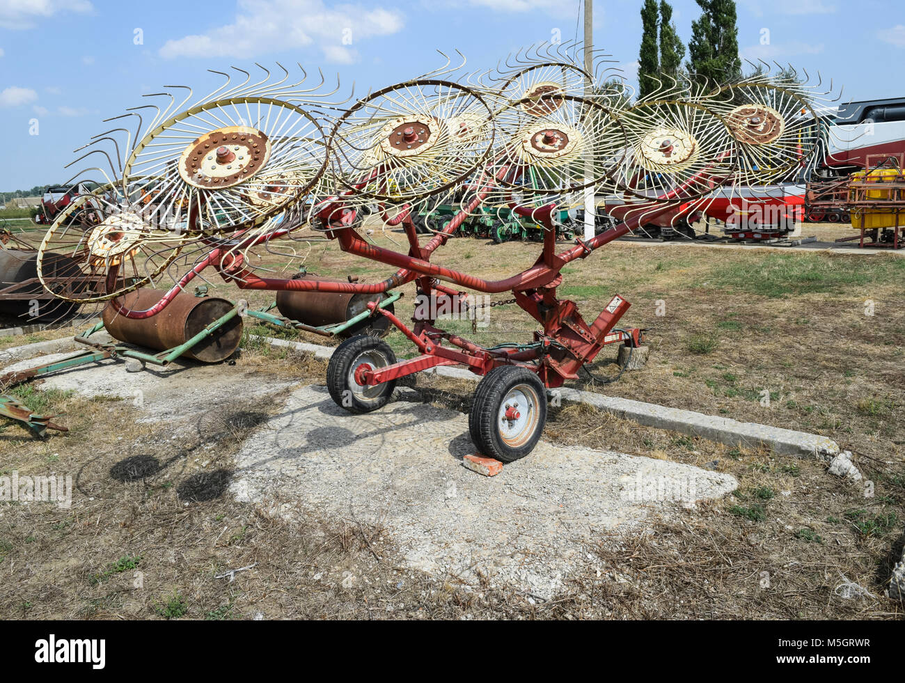 Tedder on trailer for tractor. The machine for gathering hay Stock ...