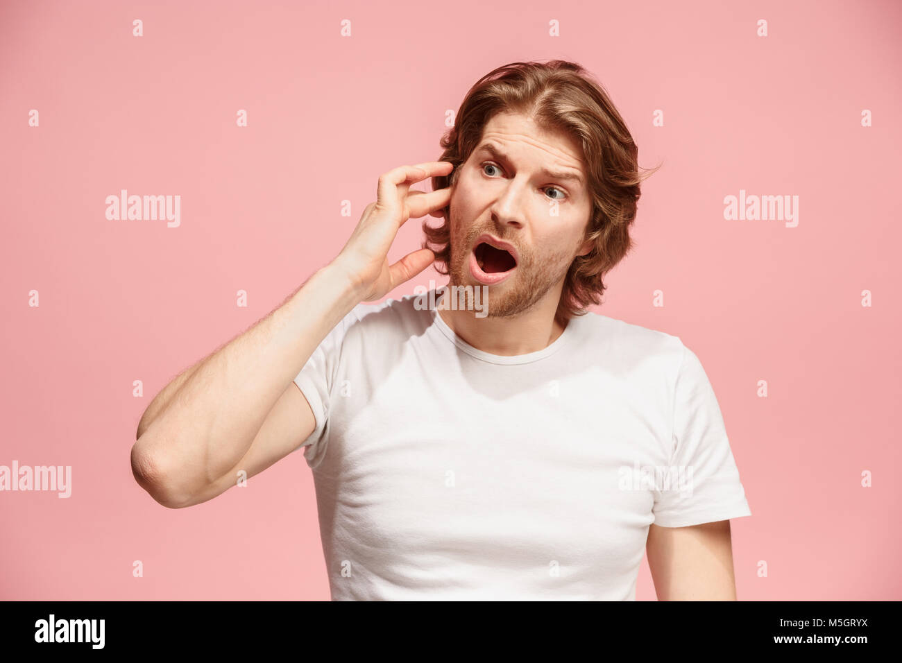 Sore ear. Ear ache concept. The sad crying man with headache or pain on ...