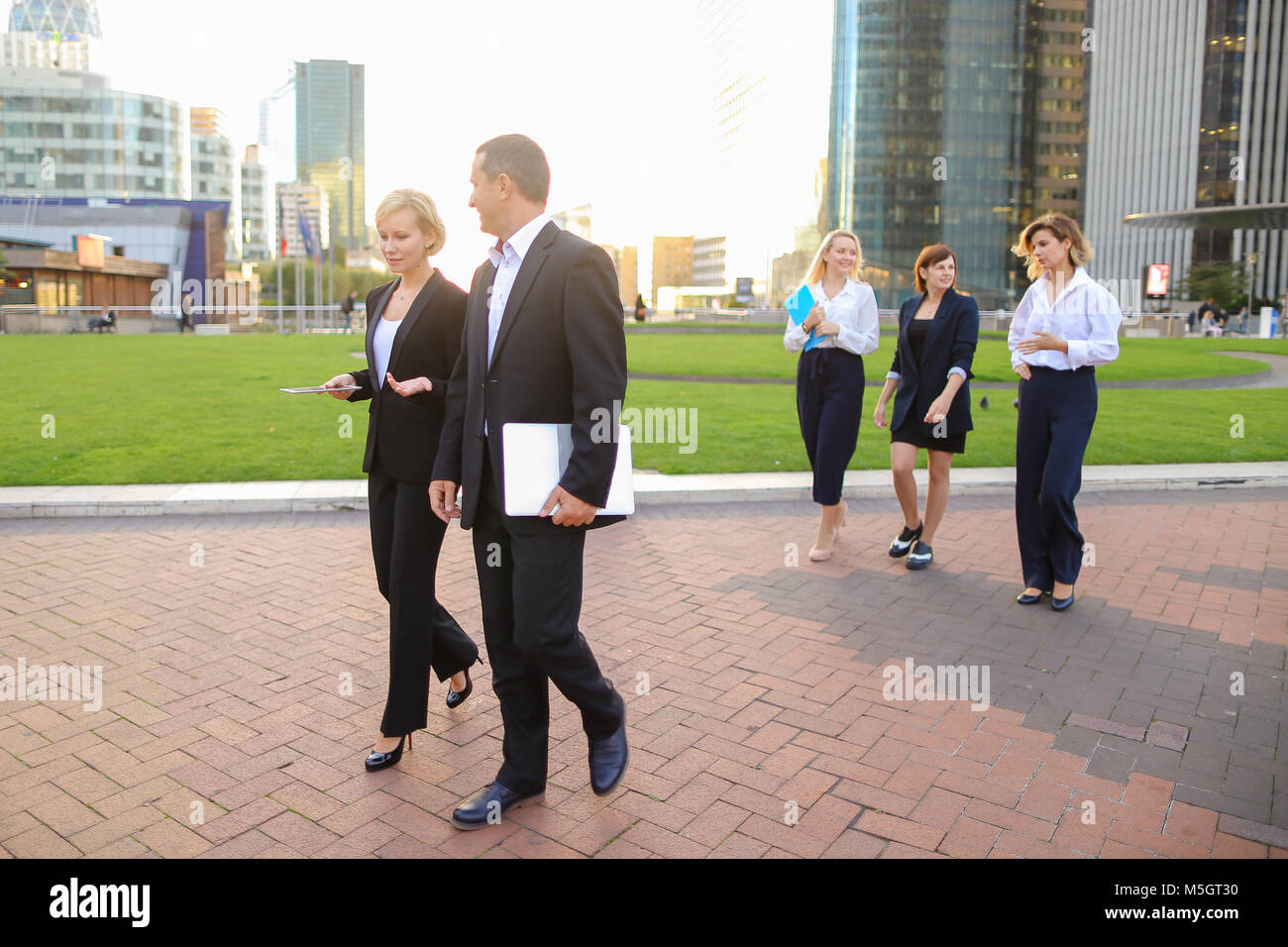Colleagues walking after business conference in La Defense Paris Stock ...