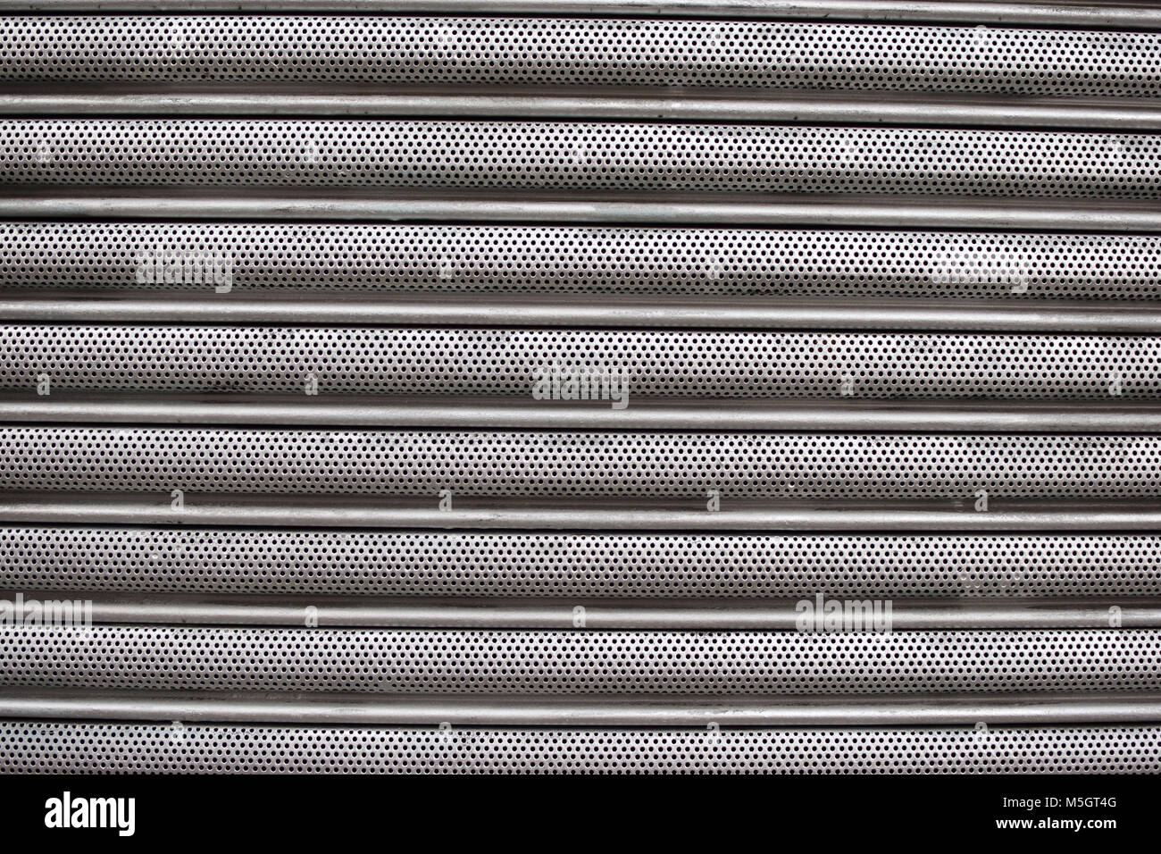 Perforated metal slats closeup texture background Stock Photo - Alamy