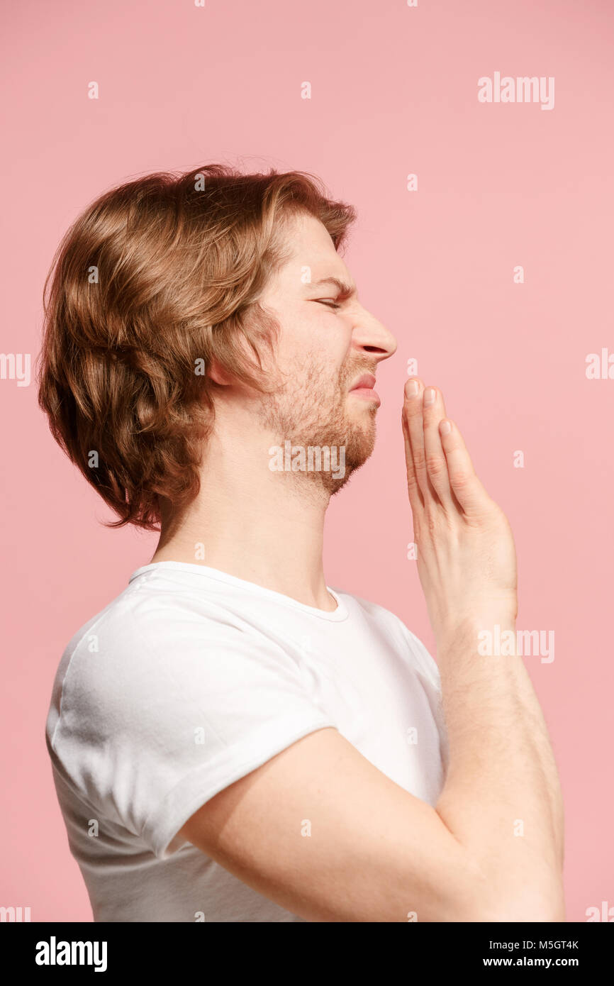 It's so gross. Young man with disgusted expression repulsing something ...