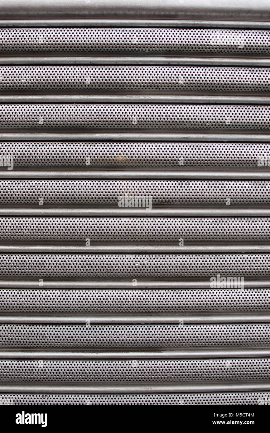 Perforated metal slats closeup texture background Stock Photo - Alamy